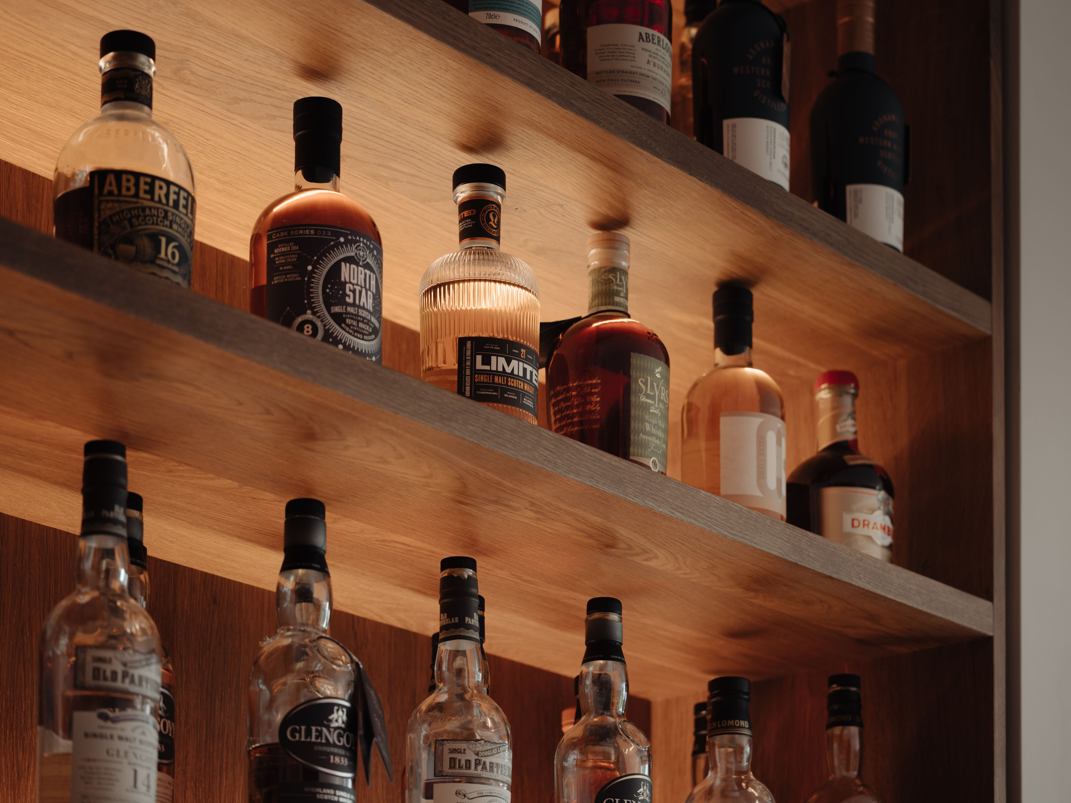 Cairn House | Custom Whisky Room, Pivot Door + Furniture | Angus+Mack