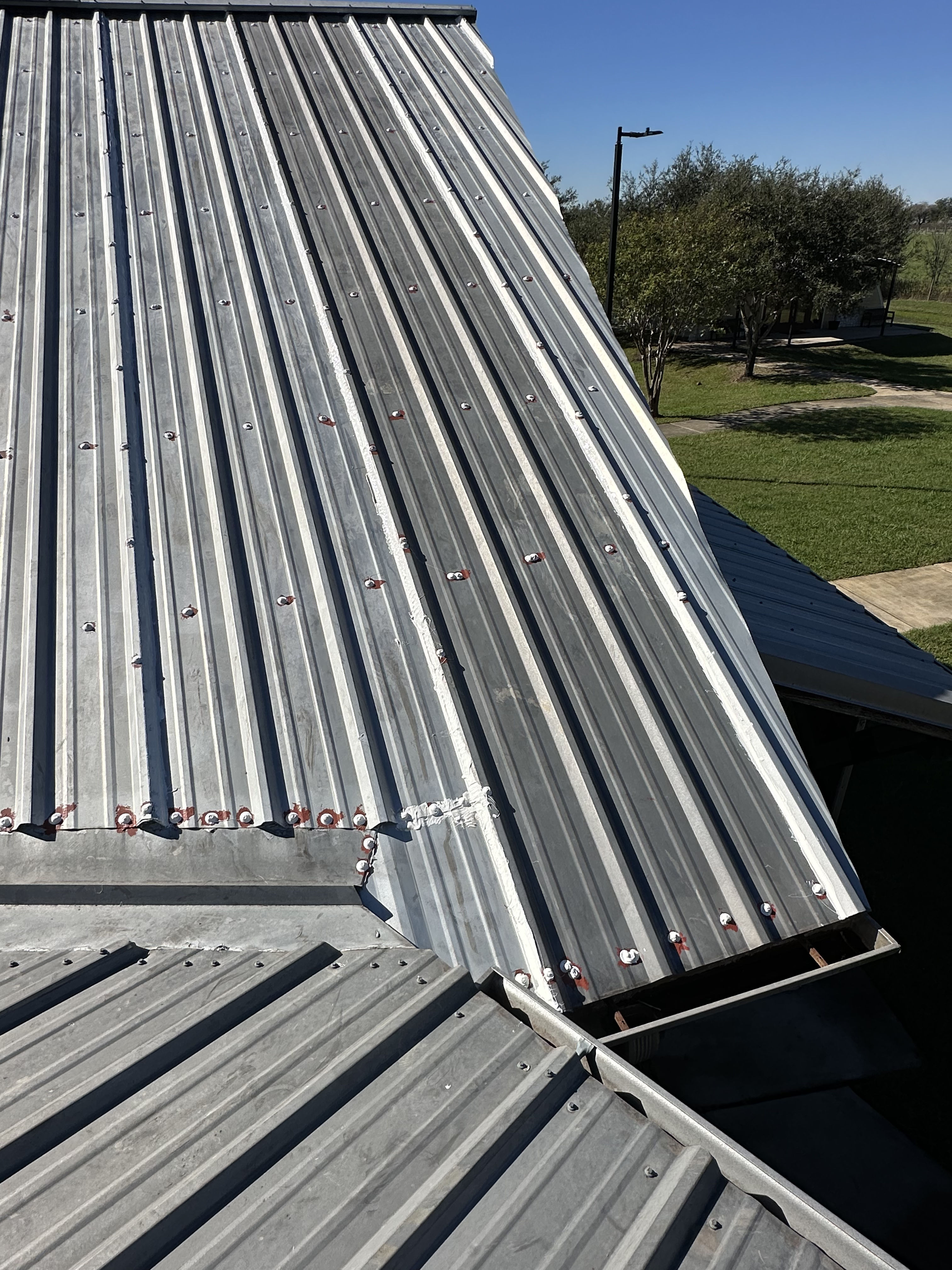 Metal Roof Maintenance with Seam Sealing and Skylight Care | Ducks Back ...