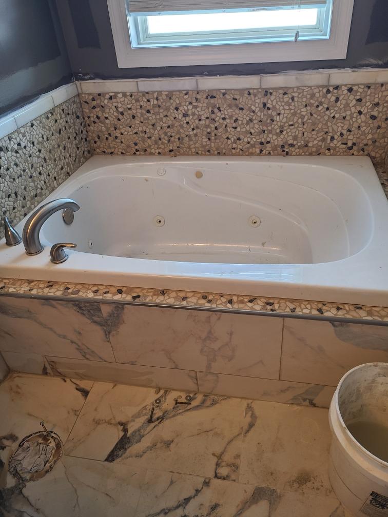 Elegant Jacuzzi Tub Installation with Mosaic Tile Border | Total ...