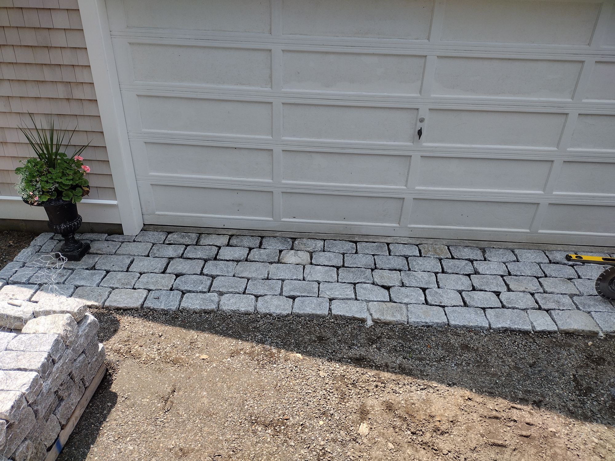 Cobblestone Entrance Installation | J & J lawncare and landscapes inc.