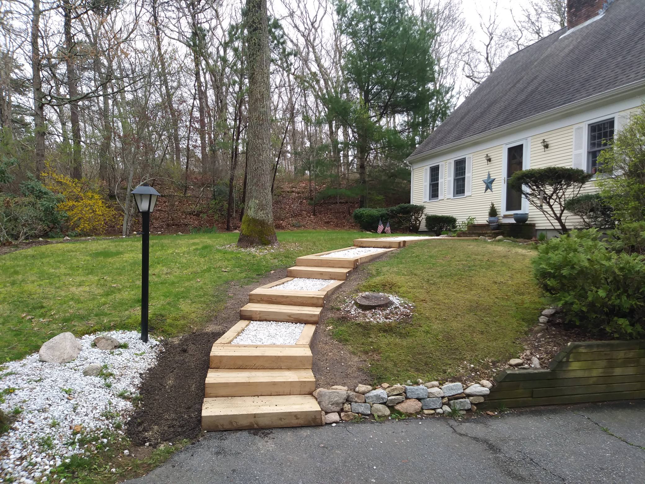 Front Yard Transformation with Wooden Steps and Gravel Path | J & J ...