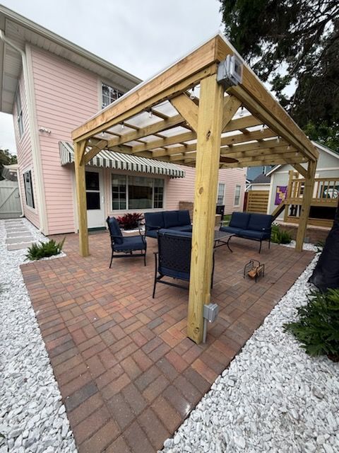 Charming Patio with Wooden Pergola in River Ridge | Modern Construction ...
