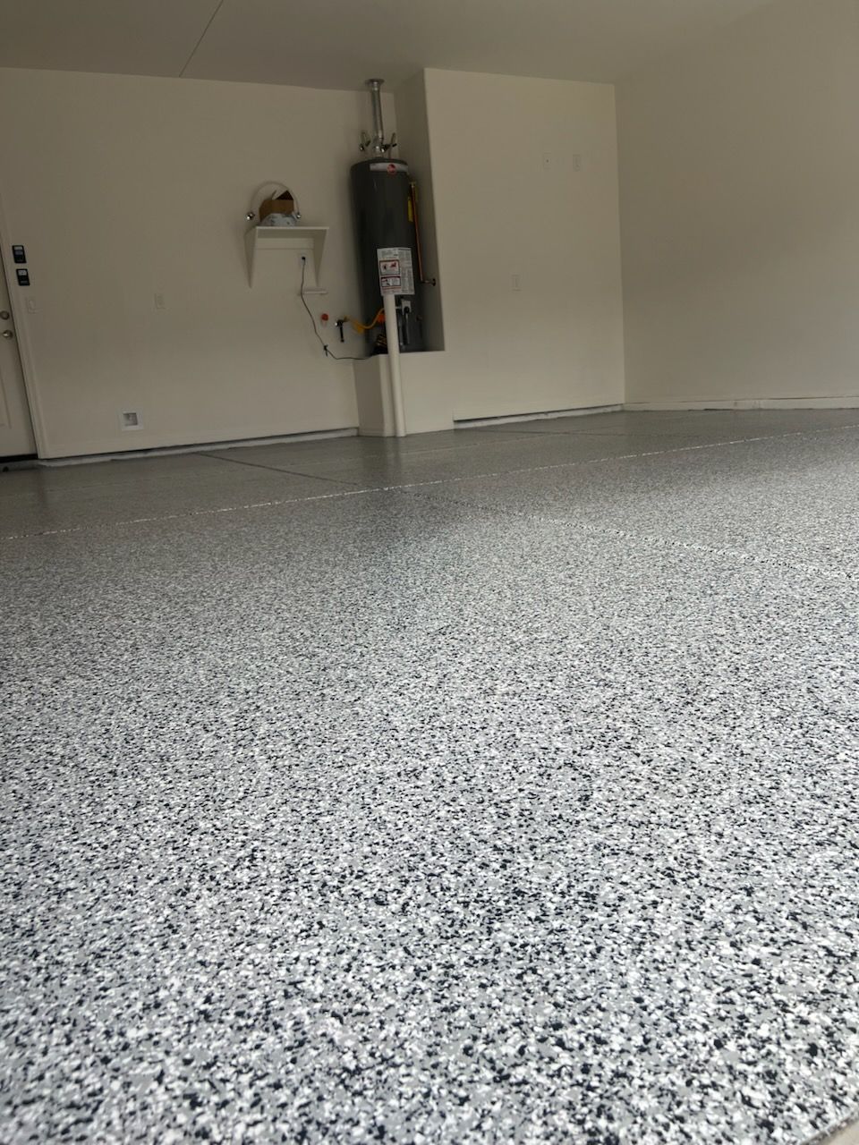 Sleek Epoxy Garage Floor Using Tuxedo Color | Luxe Finishes LLC
