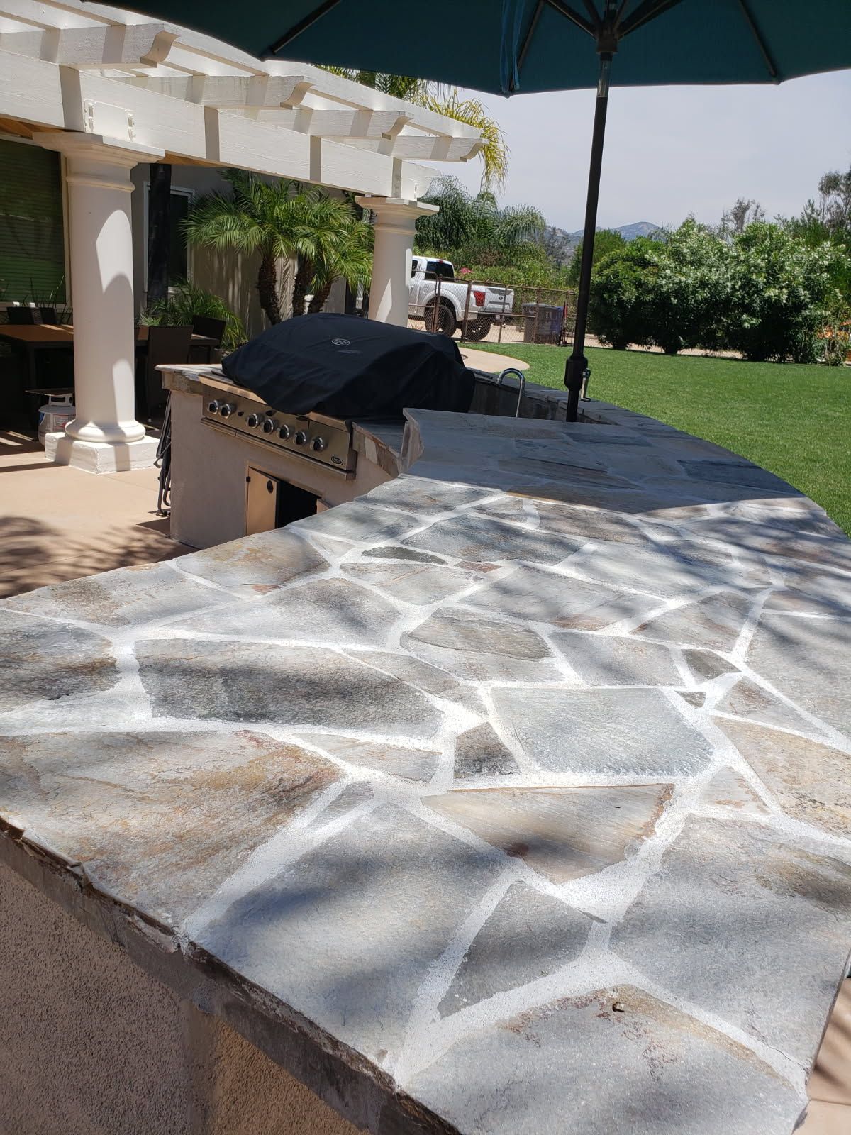 Beautiful Flagstone Outdoor Kitchen Installation | Renewabuilt Inc