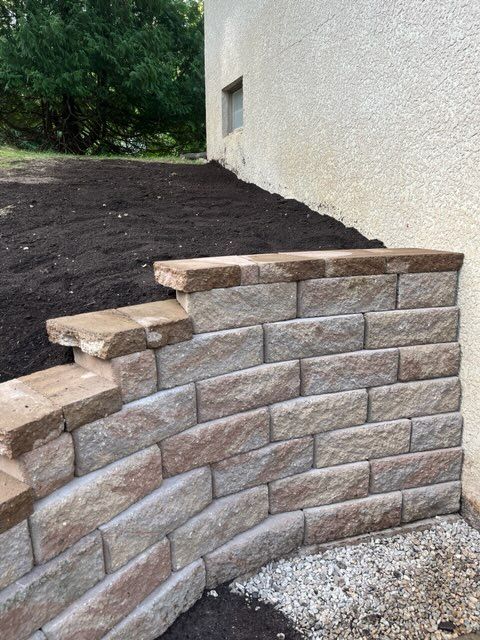 Sturdy Custom Wing Retaining Wall Installed | Walker Outdoor Solutions ...