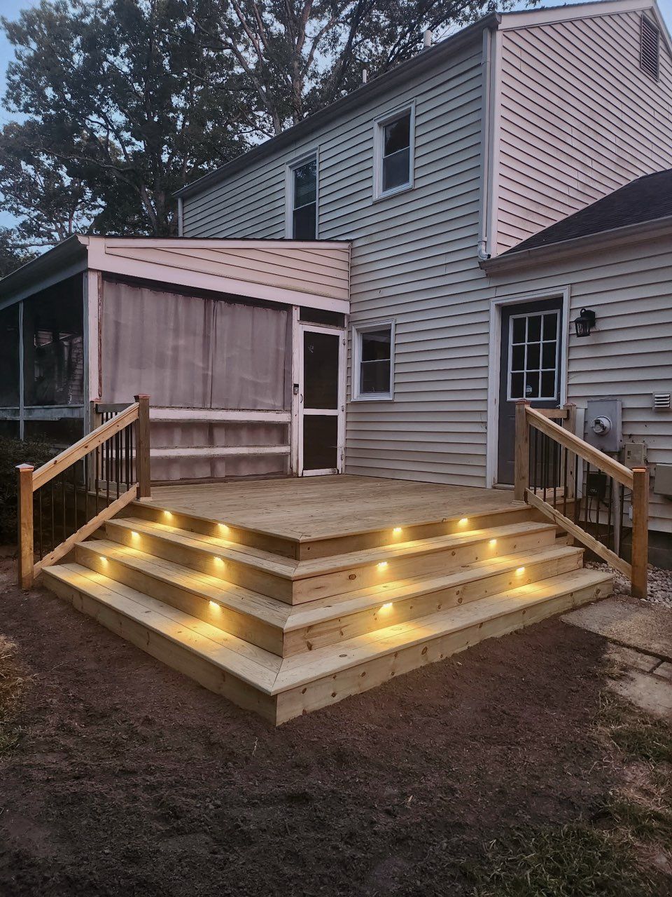 Stunning Deck with Cascade Stairs and Lighting | GMScapes LLC