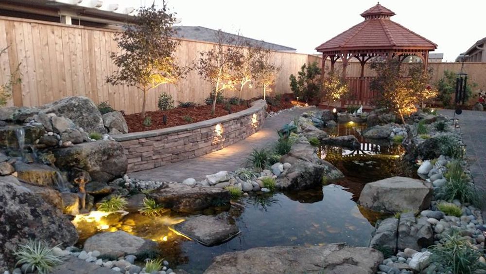 Natural Koi Pond and Gazebo with Waterfall | Parker Landscape, Inc.