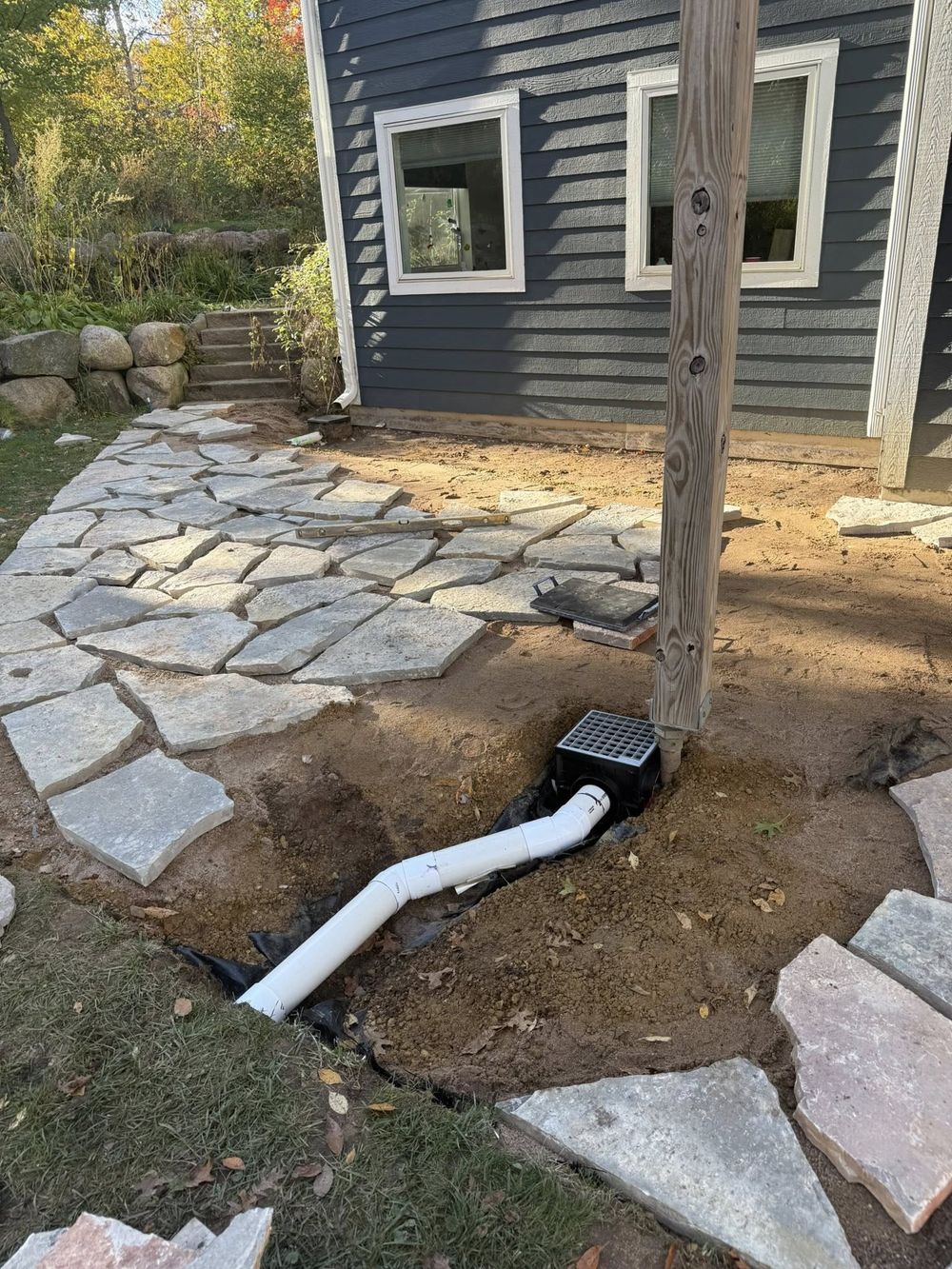Custom Flagstone Patio Installation in Hugo | Extra Mile Outdoor Services