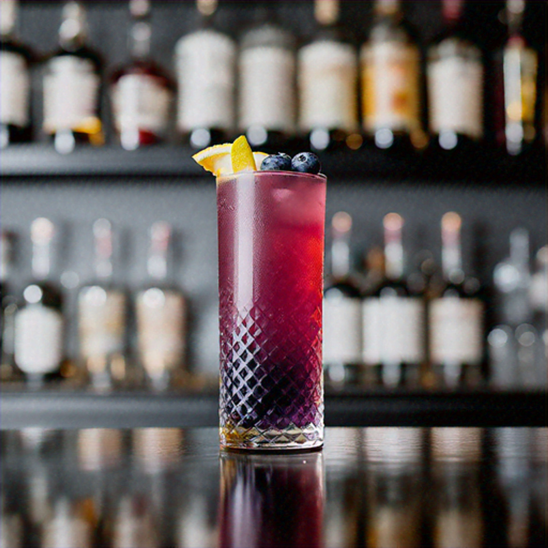 Blueberry Zest Fizz, Vibrant blueberry cocktail with ginger beer fizz