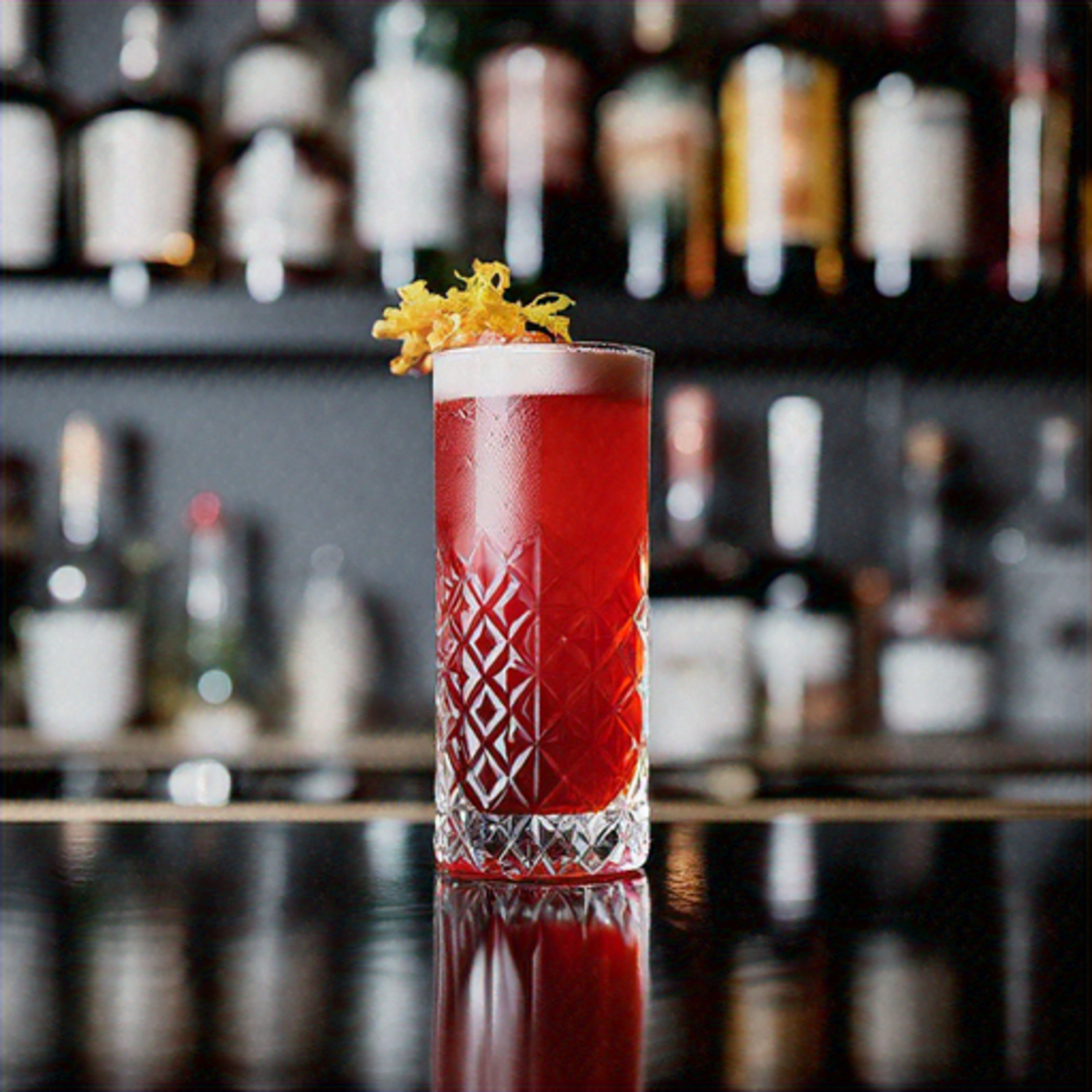 Inferno Blossom, Bright red cocktail with fiery kick and floral sweetness