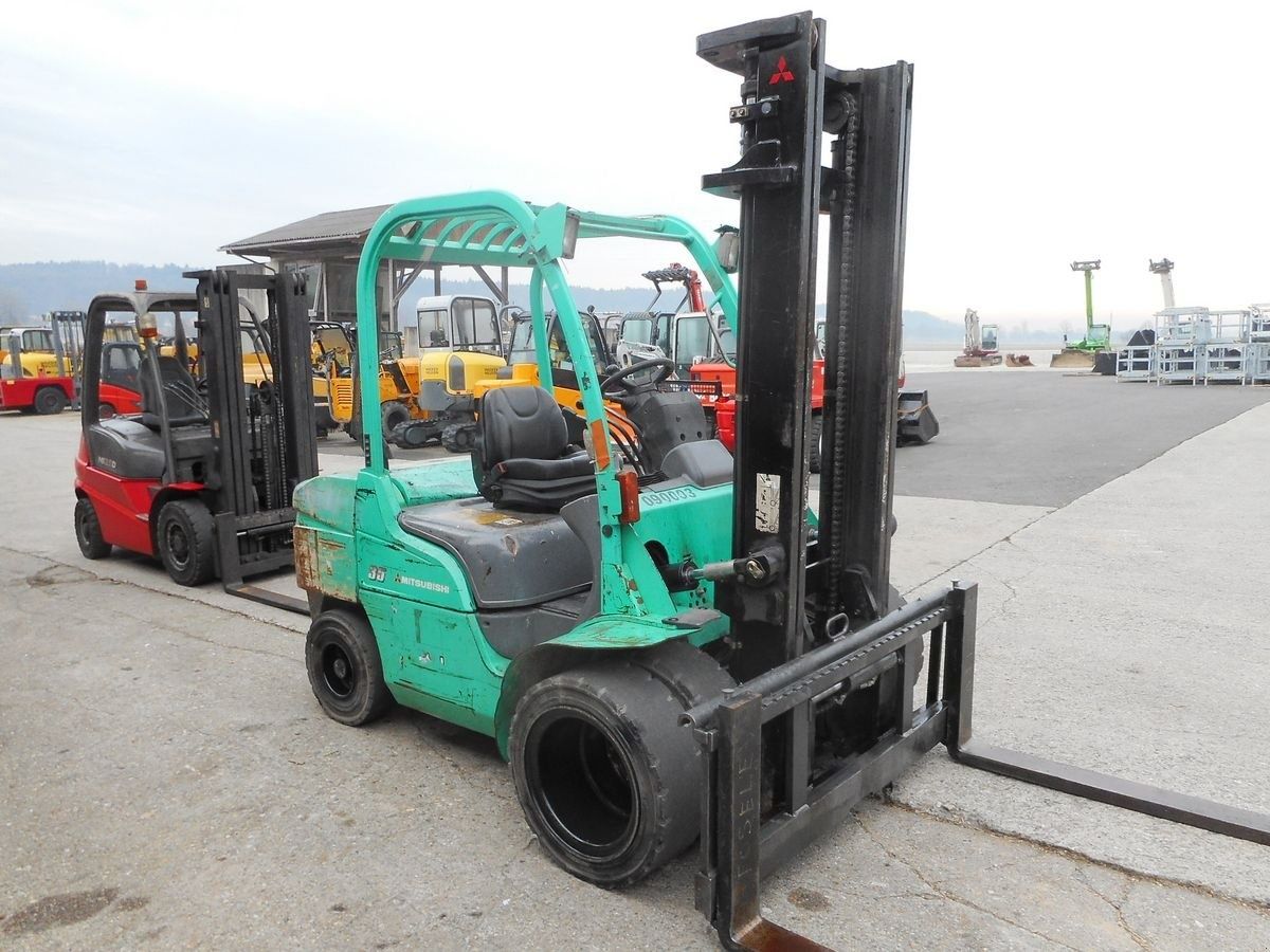 E FARM MITSUBISHI fd35n mit zwillingreifen und breiten gabeltrager Forklift id 2T7C9ZI 10 500 Year of construction 2006 Engine hours 13 347 Austria