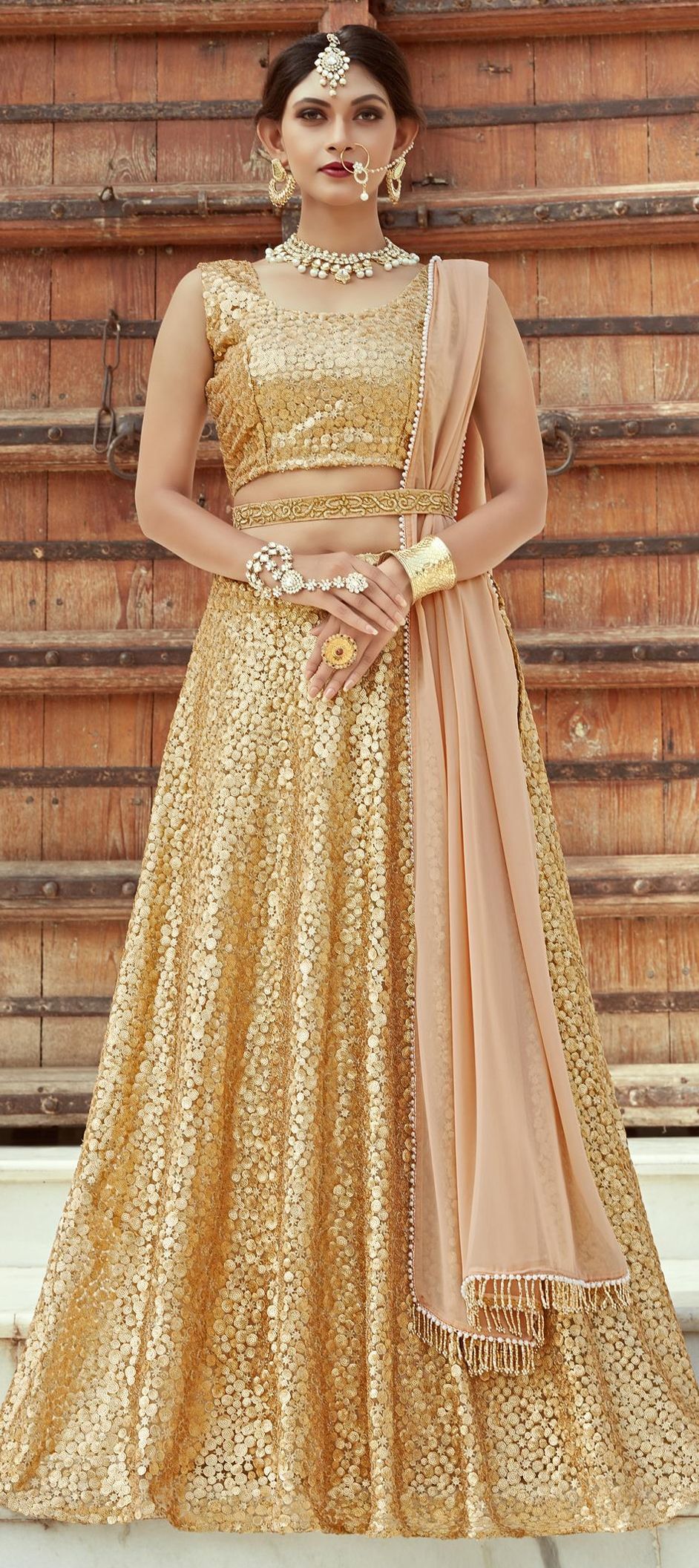 1514404: Mehendi Sangeet Beige and Brown color Net fabric Lehenga
