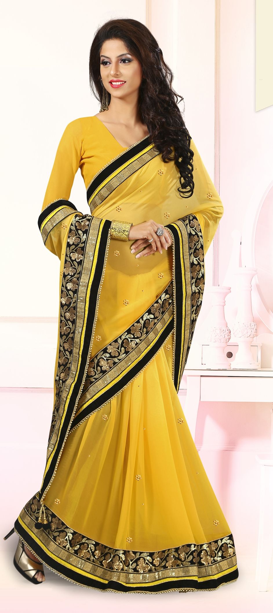 174628: Yellow color family Saree with matching unstitched blouse.