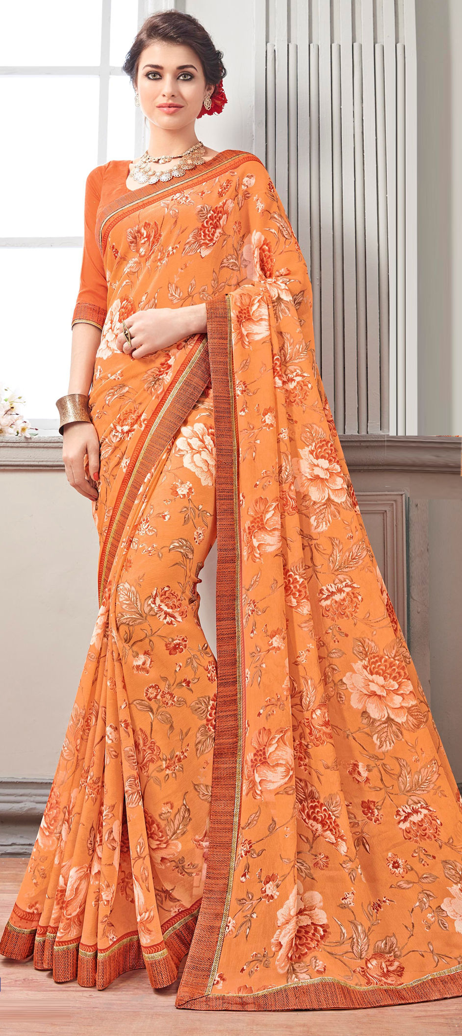 739944: Orange color family Printed Sarees with matching unstitched blouse.